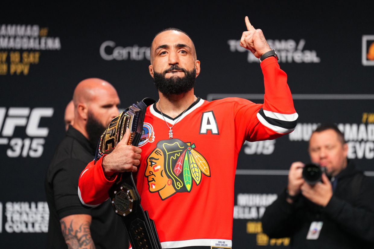 Чемпион UFC Мухаммад прибыл на арену в Монреале в джерси клуба НХЛ ...